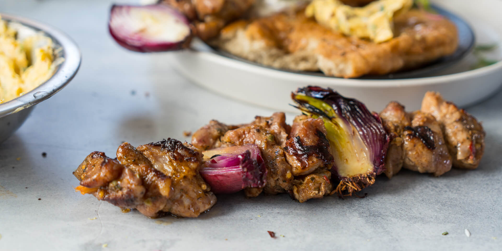 Eskort - Prego Kebab on Fried Flatbread with Spiced Butter & Red Onion ...